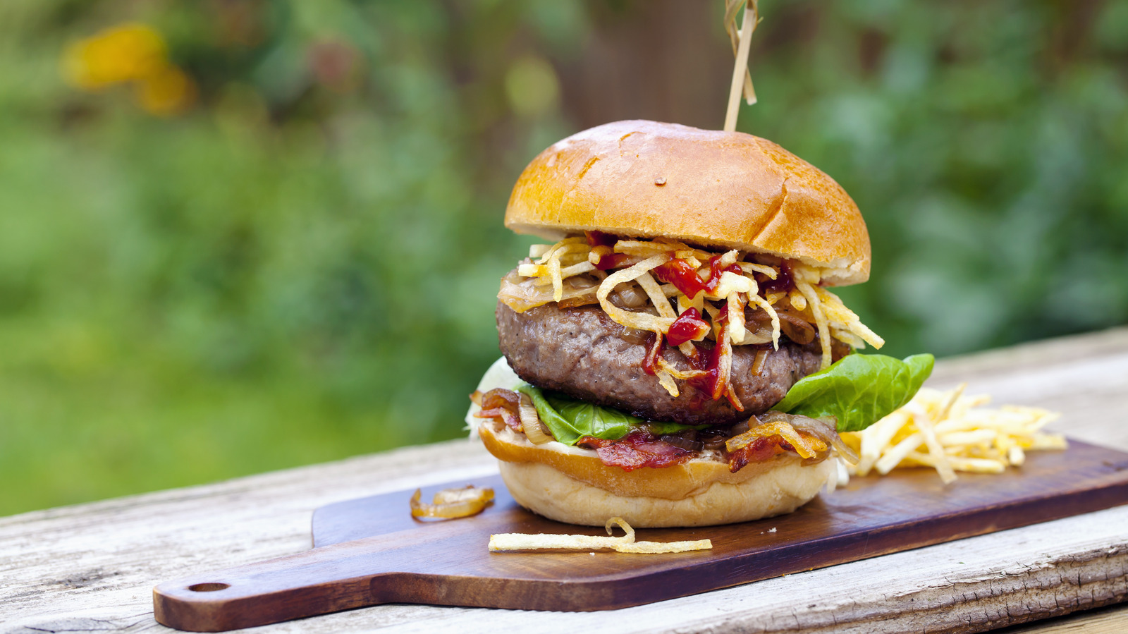 Forget The Rings, Top Your Burger With Onion Strings Instead