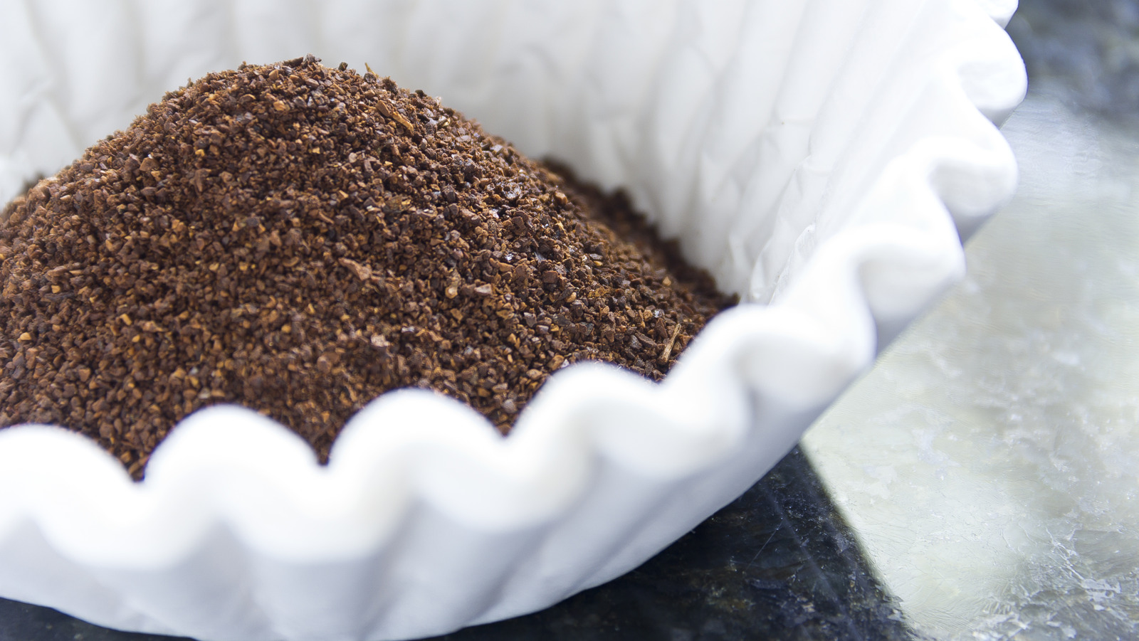 The Coffee Filter Hack For Avoiding A Gross Clogged Kitchen Sink