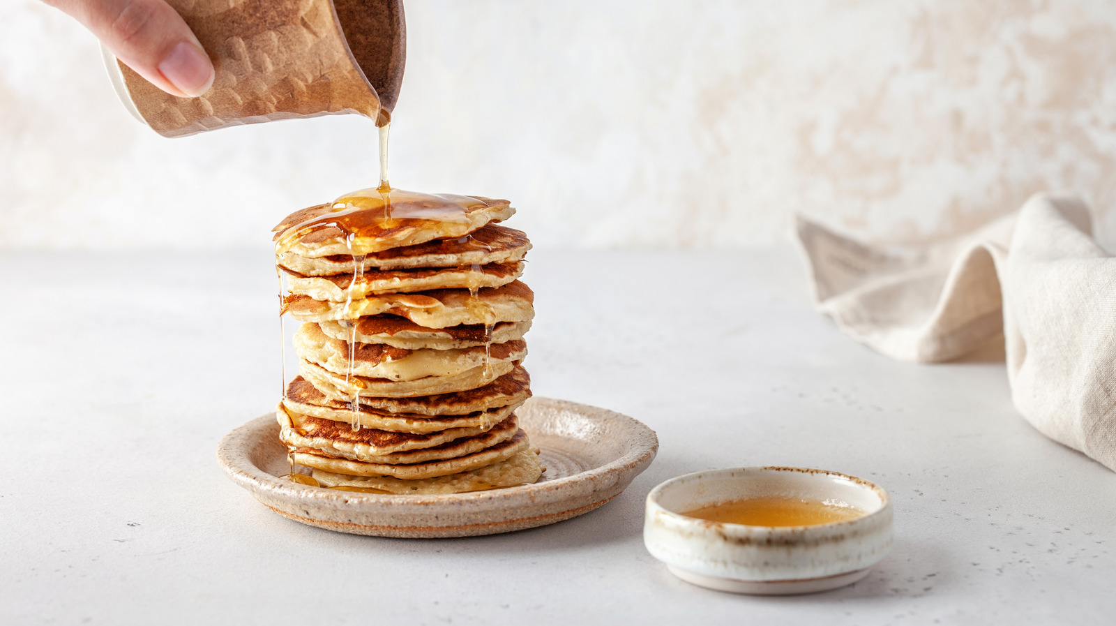 The Genius Hack To Easily Douse A Stack Of Pancakes With Syrup