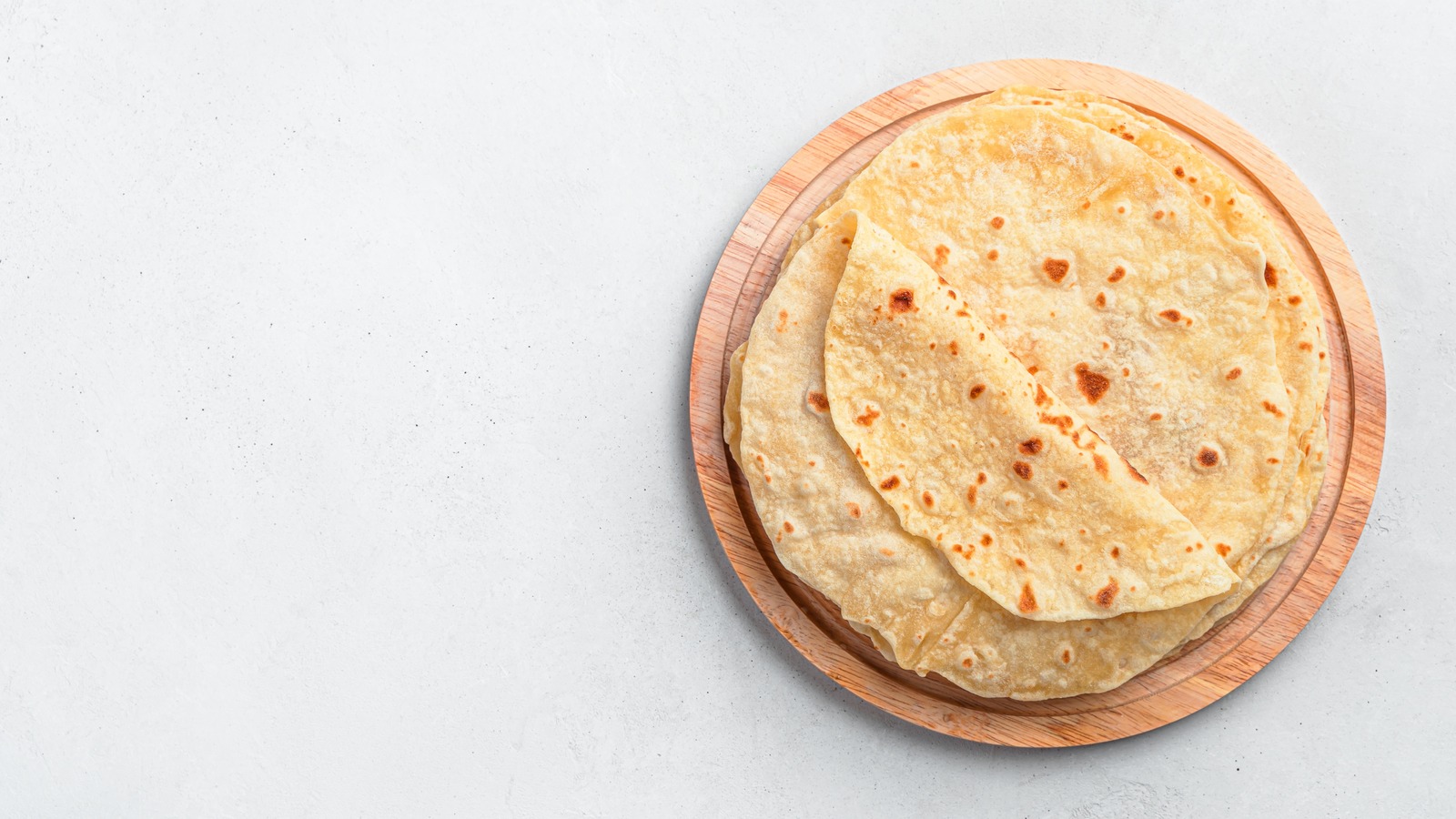The Tortilla Stacking Hack For Quickly Warming Up A Whole Bunch