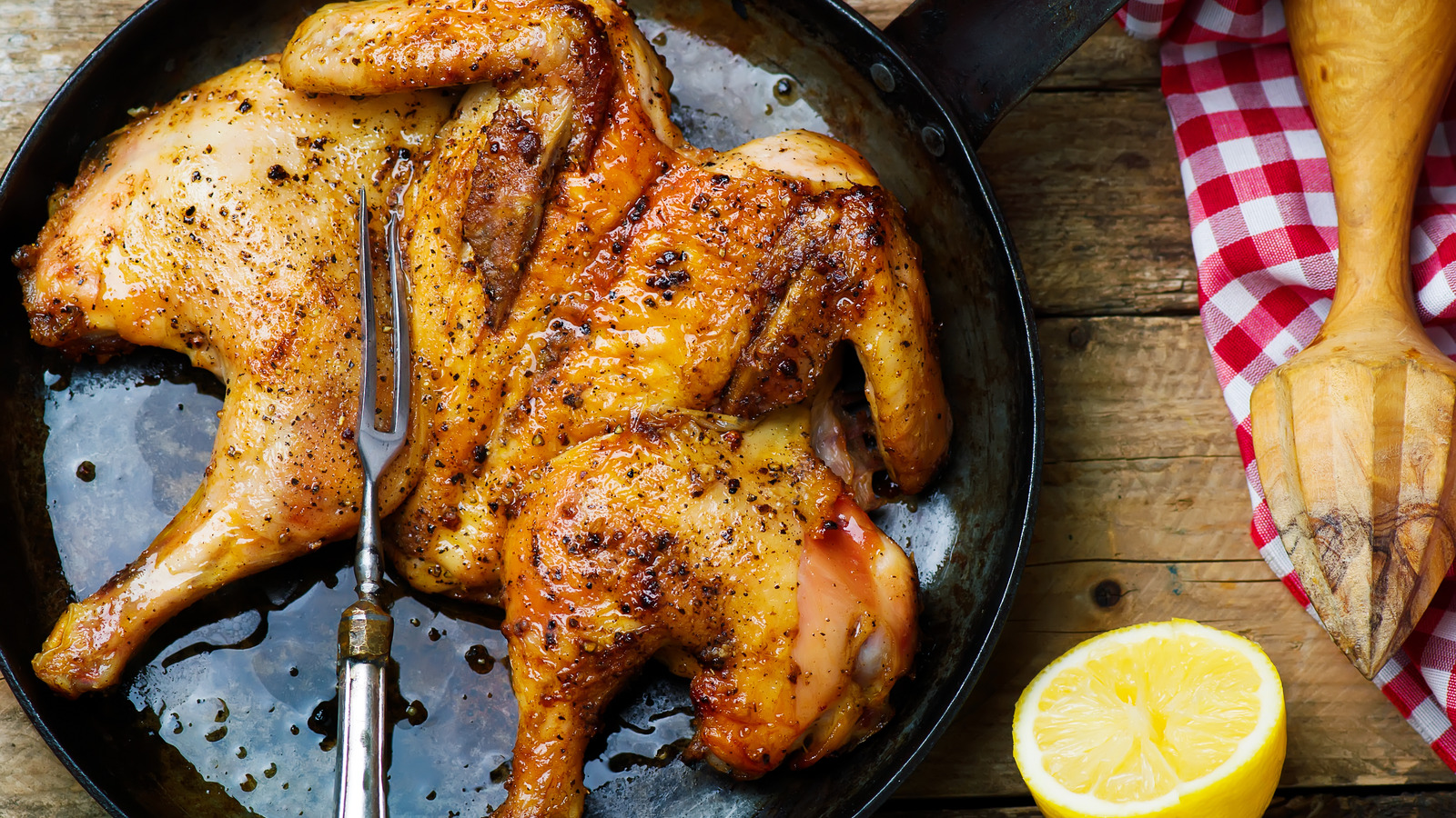 Why Roasting Chicken Under A Brick Creates The Crispiest Results