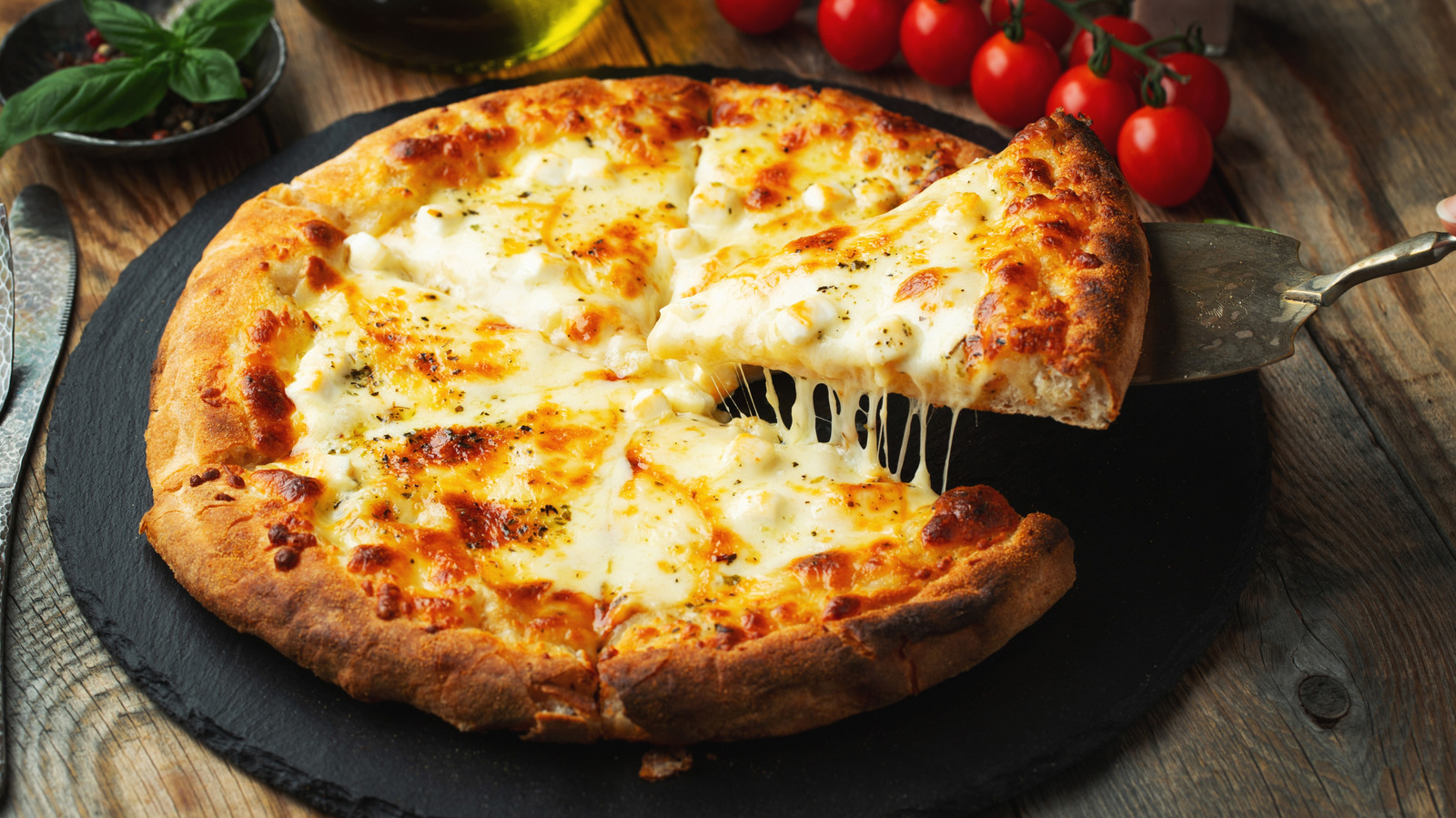 You're Seriously Missing Out If You've Never Put This Cheese On Pizza